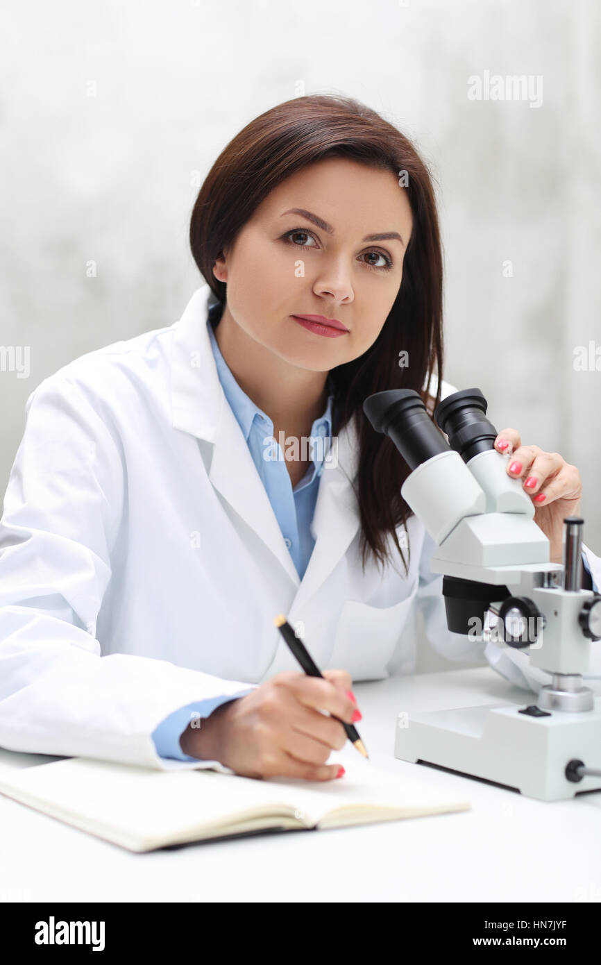 Professional. Scientist with microscope at work Stock Photo - Alamy