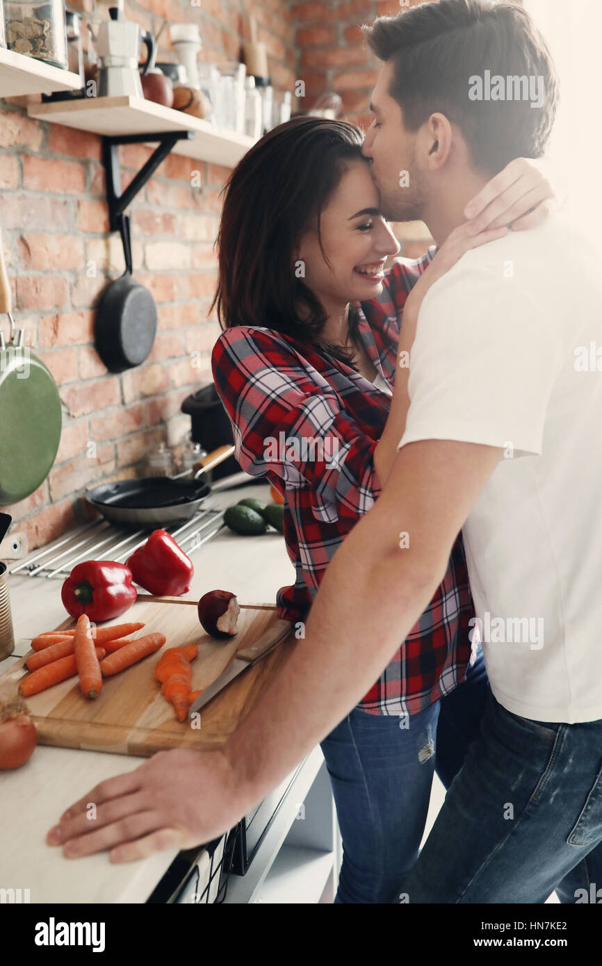Lovely couple in the kitchen Stock Photo - Alamy