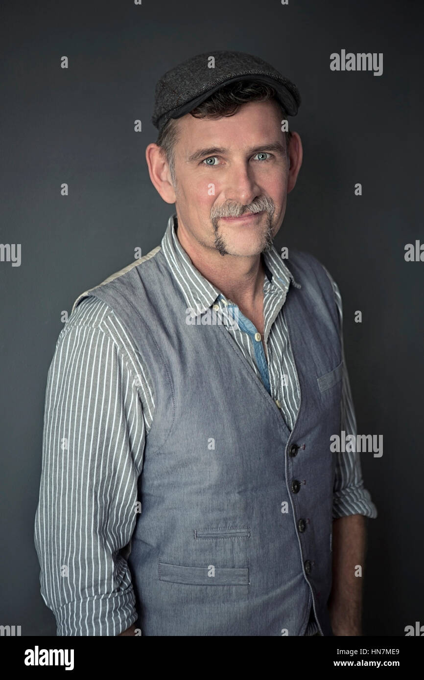 portrait of handsome stylish man in his 50s Stock Photo - Alamy
