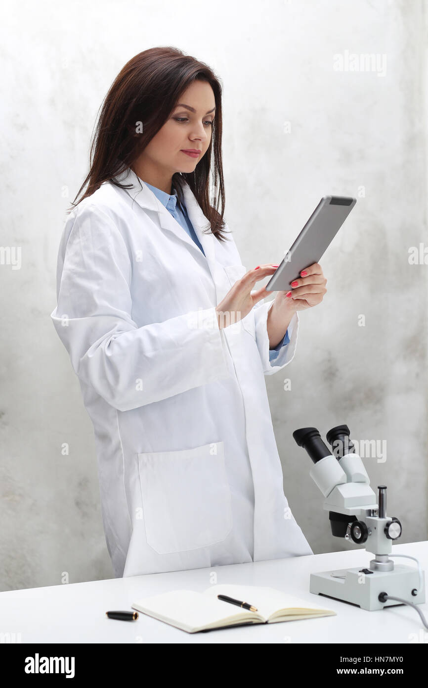 Professional. Scientist with microscope at work Stock Photo - Alamy