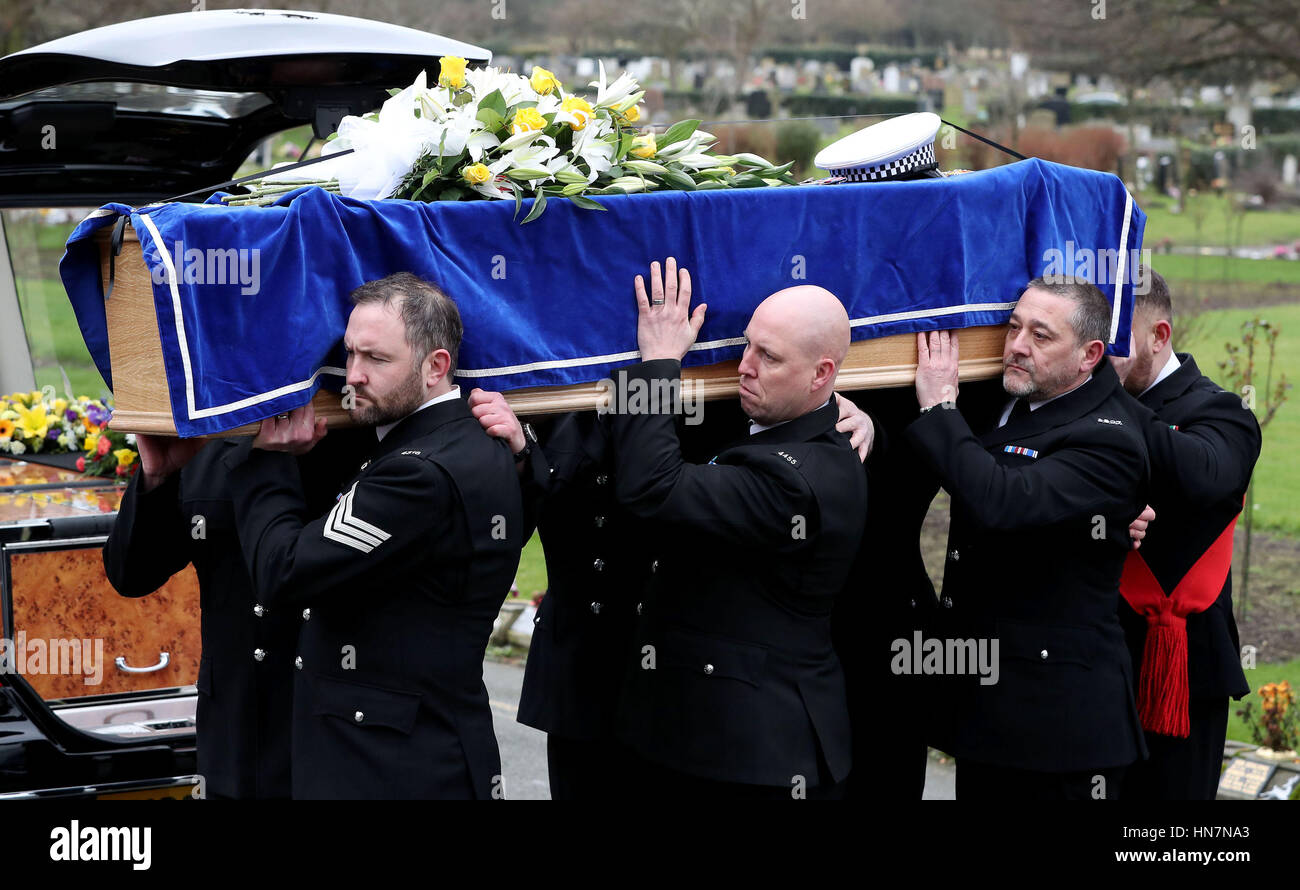 The coffin of PC Paul Briggs is carried in to the chapel at Landican ...