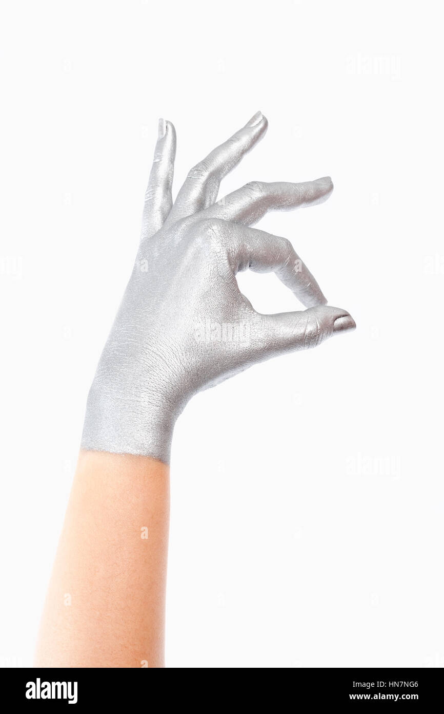 Hand with Silver Colour on Making Gestures Stock Photo - Alamy