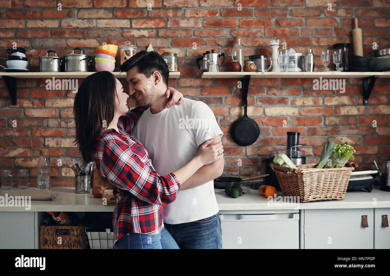 Lovely couple in the kitchen Stock Photo - Alamy