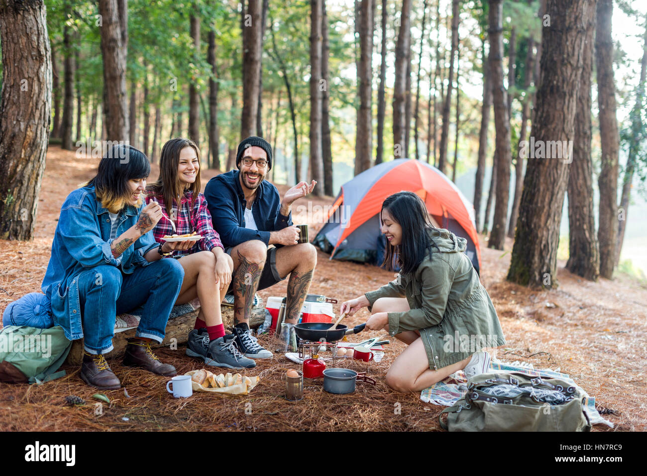 Friends Camping Eating Food Concept Stock Photo - Alamy