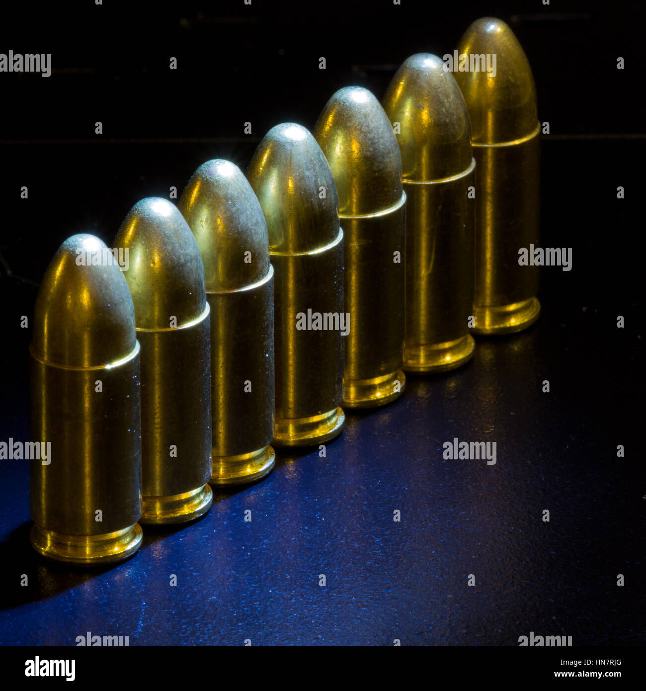 The bullets bullets lined up on black background Stock Photo - Alamy