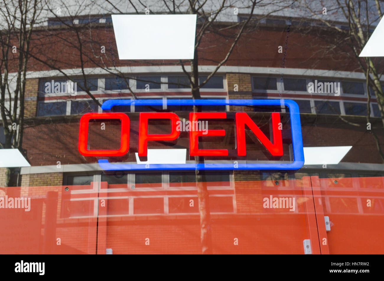 Red neon sign saying "open Stock Photo - Alamy