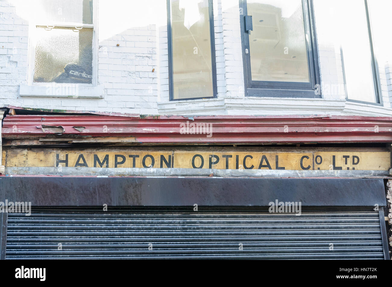Old fashioned shop sign for Hampton Optical Company in Essex Street ...