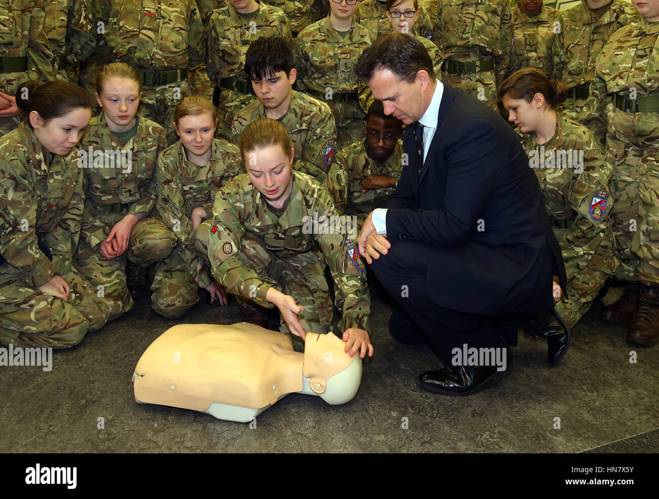 Defence Minister Mark Lancaster is shown a first aid demonstration ...
