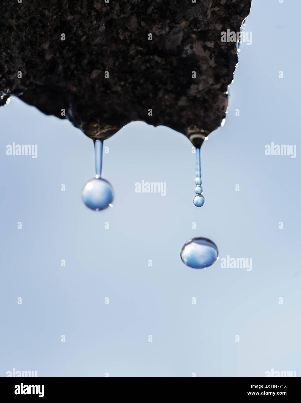 Falling water drops frozen in time Stock Photo - Alamy