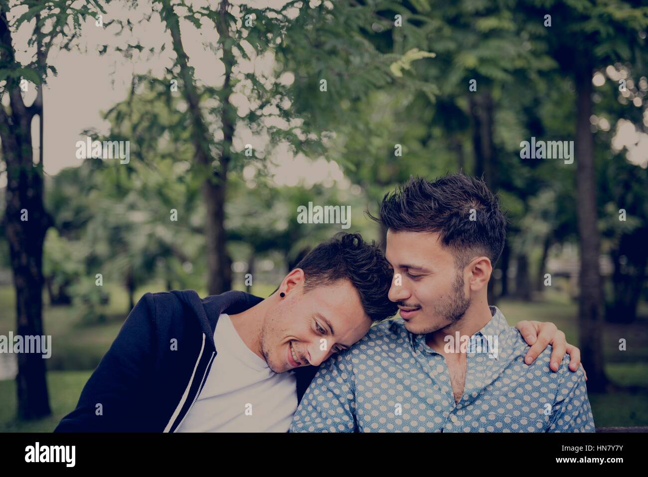Happy gay couple hugging outdoors hi-res stock photography and images ...