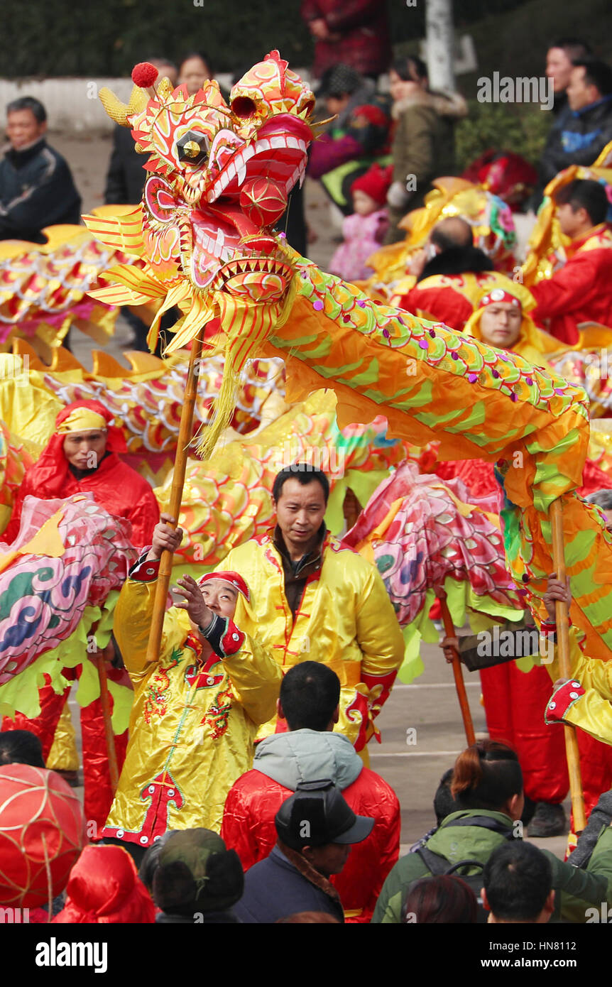 Guang'an, China. 9th Feb, 2017. People perform dragon dance in Shiyong ...