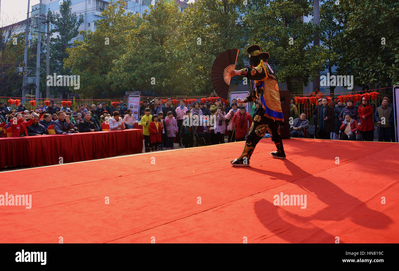Hefei, China. 9th Feb, 2017. An actor performs face changing at a ...
