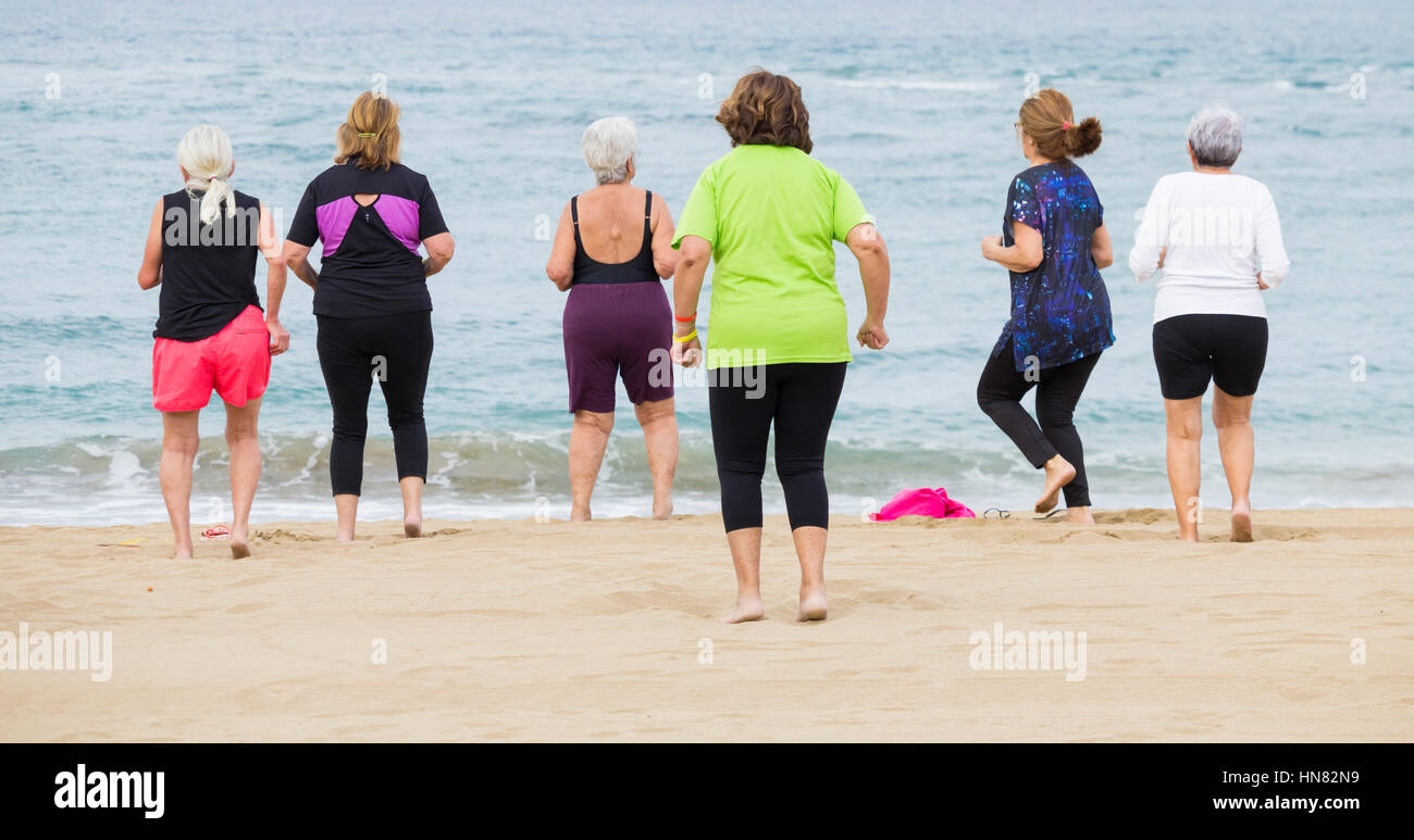Pensioners keep fit class on beach in Spain Stock Photo - Alamy