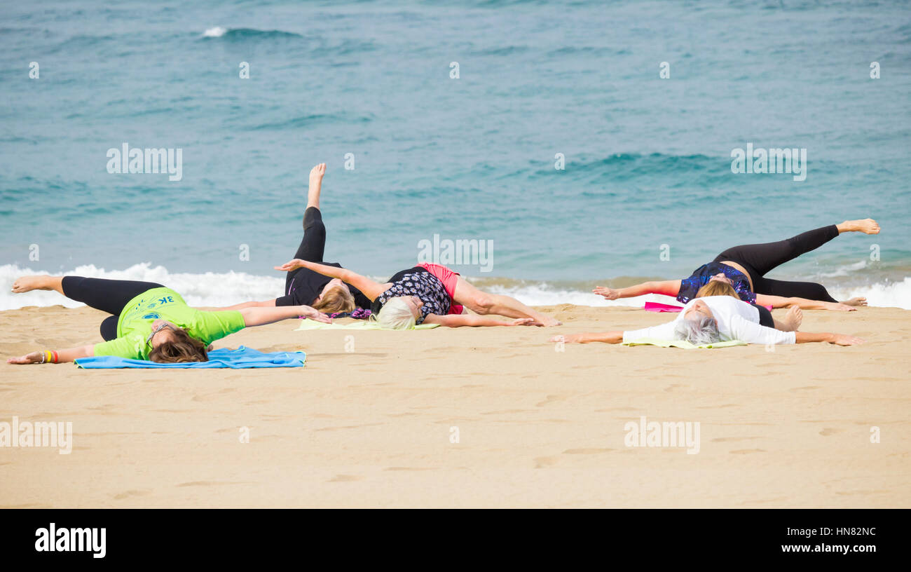 Pensioners keep fit class on beach in Spain Stock Photo - Alamy
