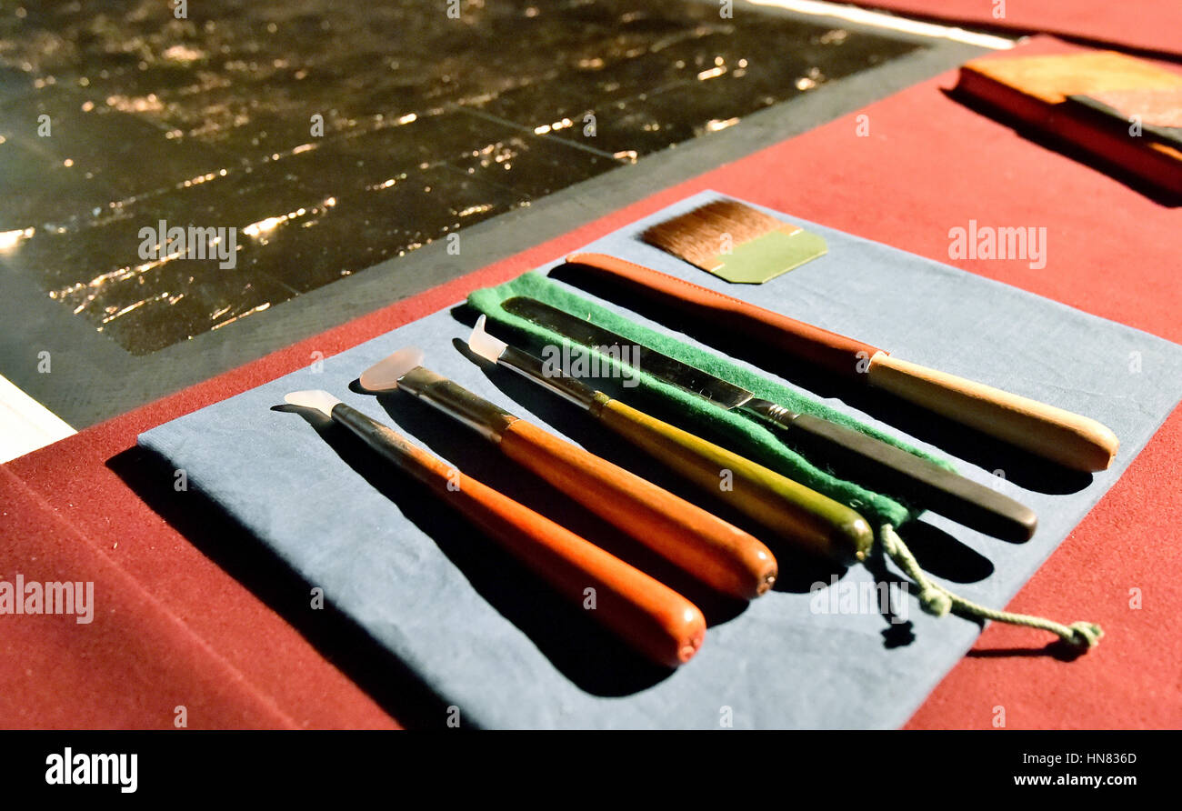 Berlin, Germany. 09th Feb, 2017. Gilding tools lie next to a surface ...