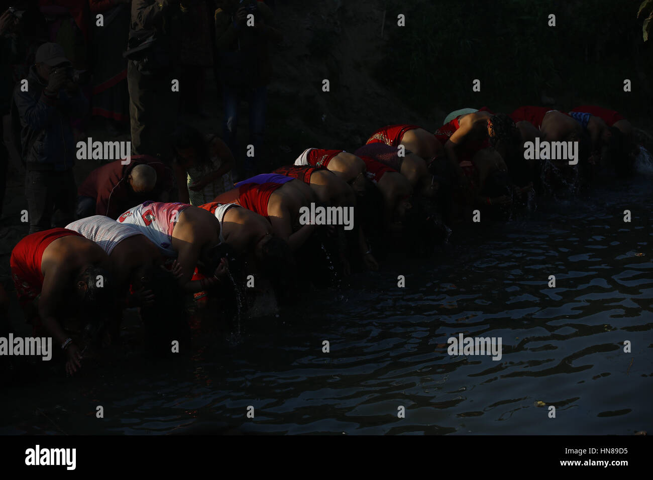 Bhaktapur, Nepal. 10th Feb, 2017. Nepalese Hindu women take a holy dip ...