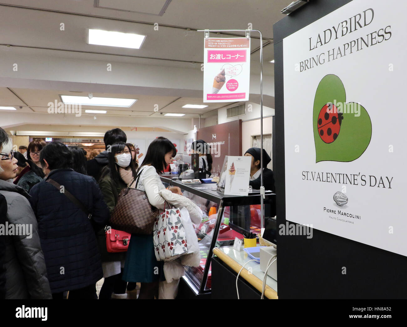 Tokyo, Japan. 10th Feb, 2017. Female customers buy boxes of chocolates ...