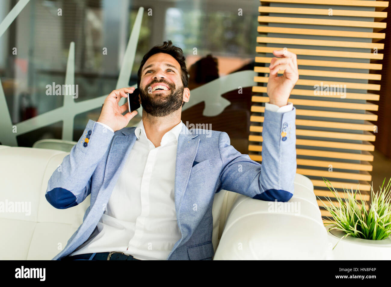 Handsome businessman talking over the mobile phone Stock Photo - Alamy