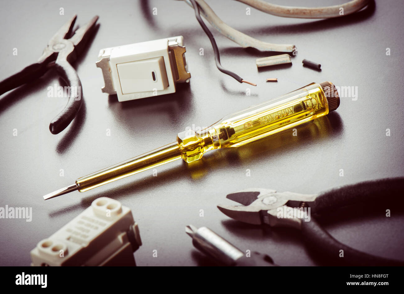 electrical tester screwdriver on technician desktop Stock Photo - Alamy