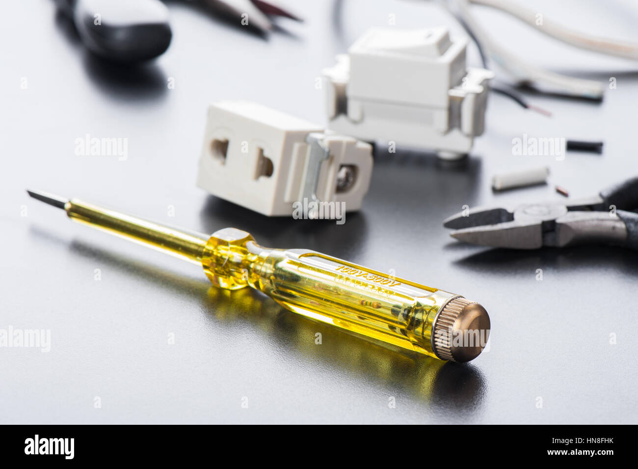 electrical tester screwdriver on technician desktop Stock Photo - Alamy
