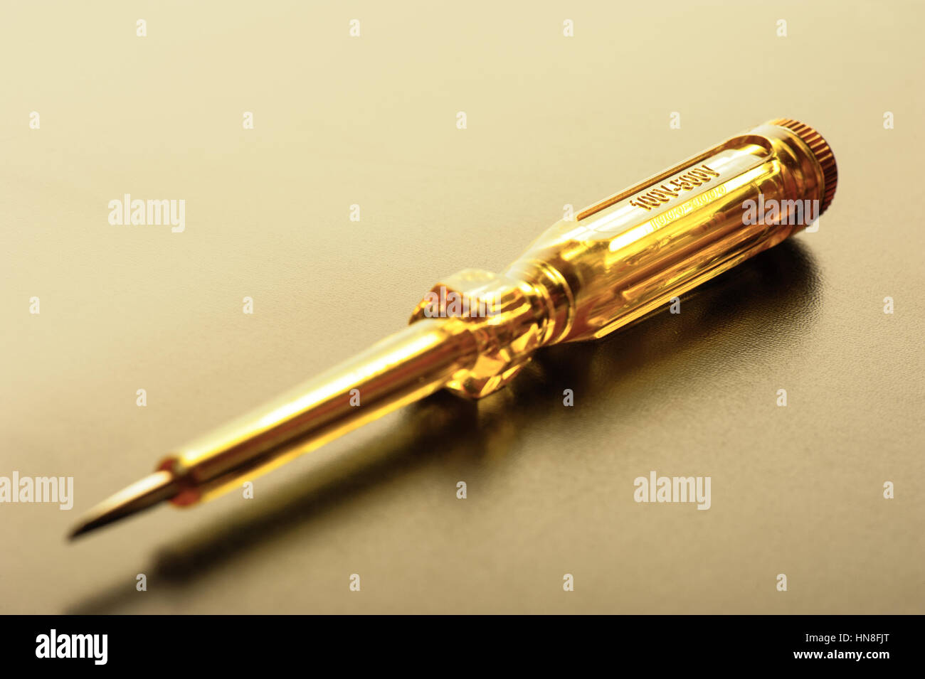 glowing yellow electrical tester screwdriver Stock Photo - Alamy