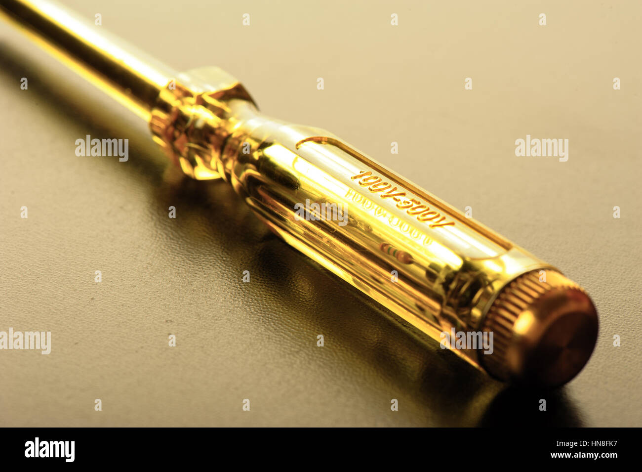 glowing yellow electrical tester screwdriver Stock Photo - Alamy