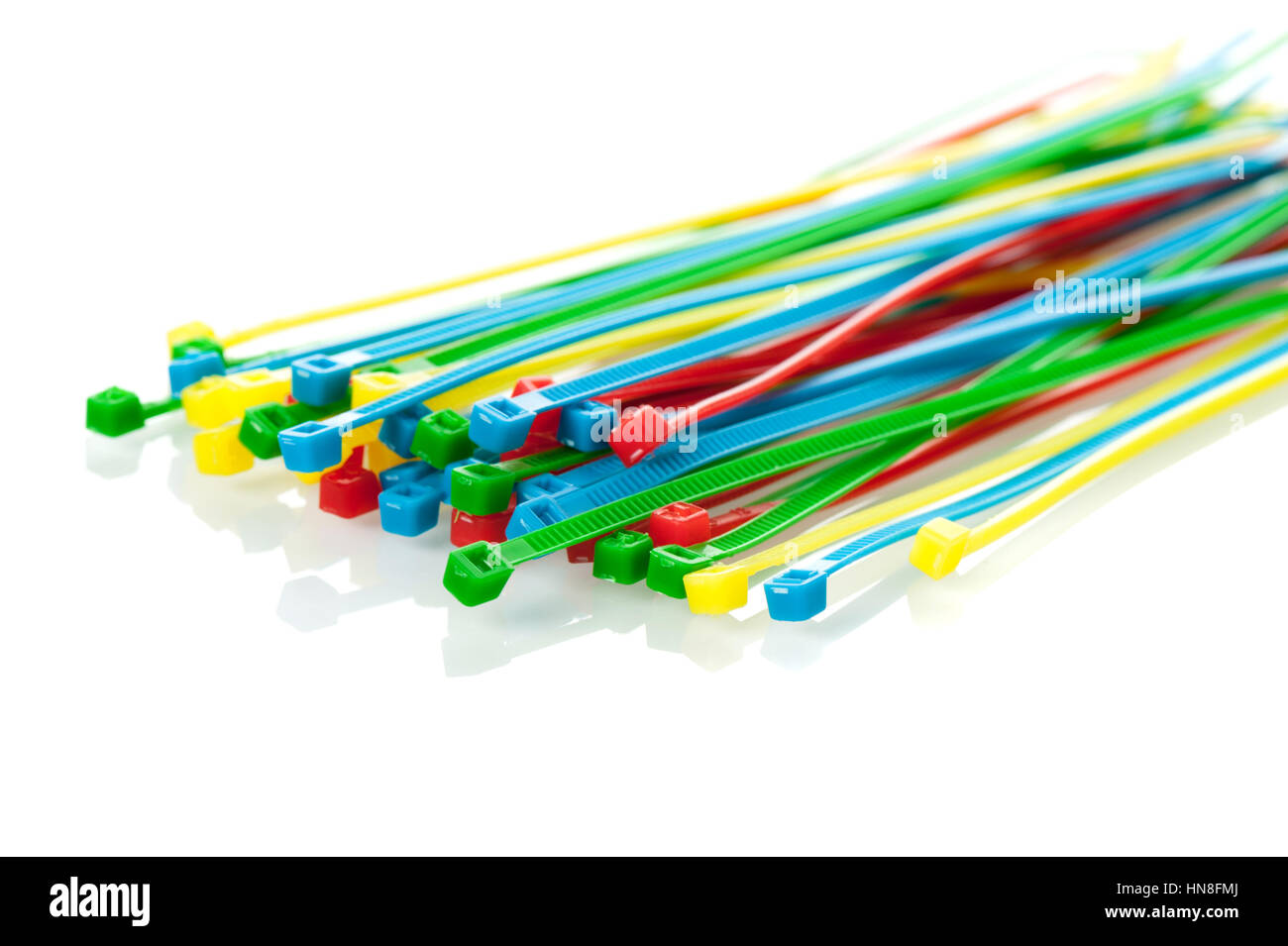 heap of colorful cable ties on white background Stock Photo - Alamy