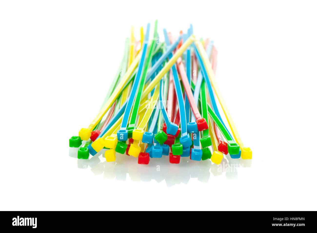 heap of colorful cable ties on white background Stock Photo - Alamy