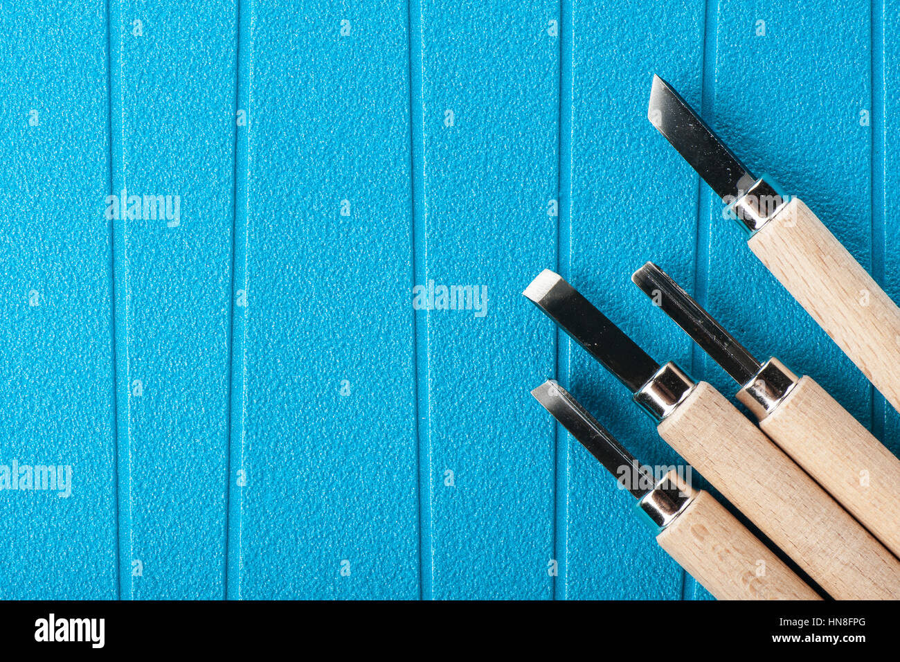 Set of new chisels isolated on blue background Stock Photo - Alamy