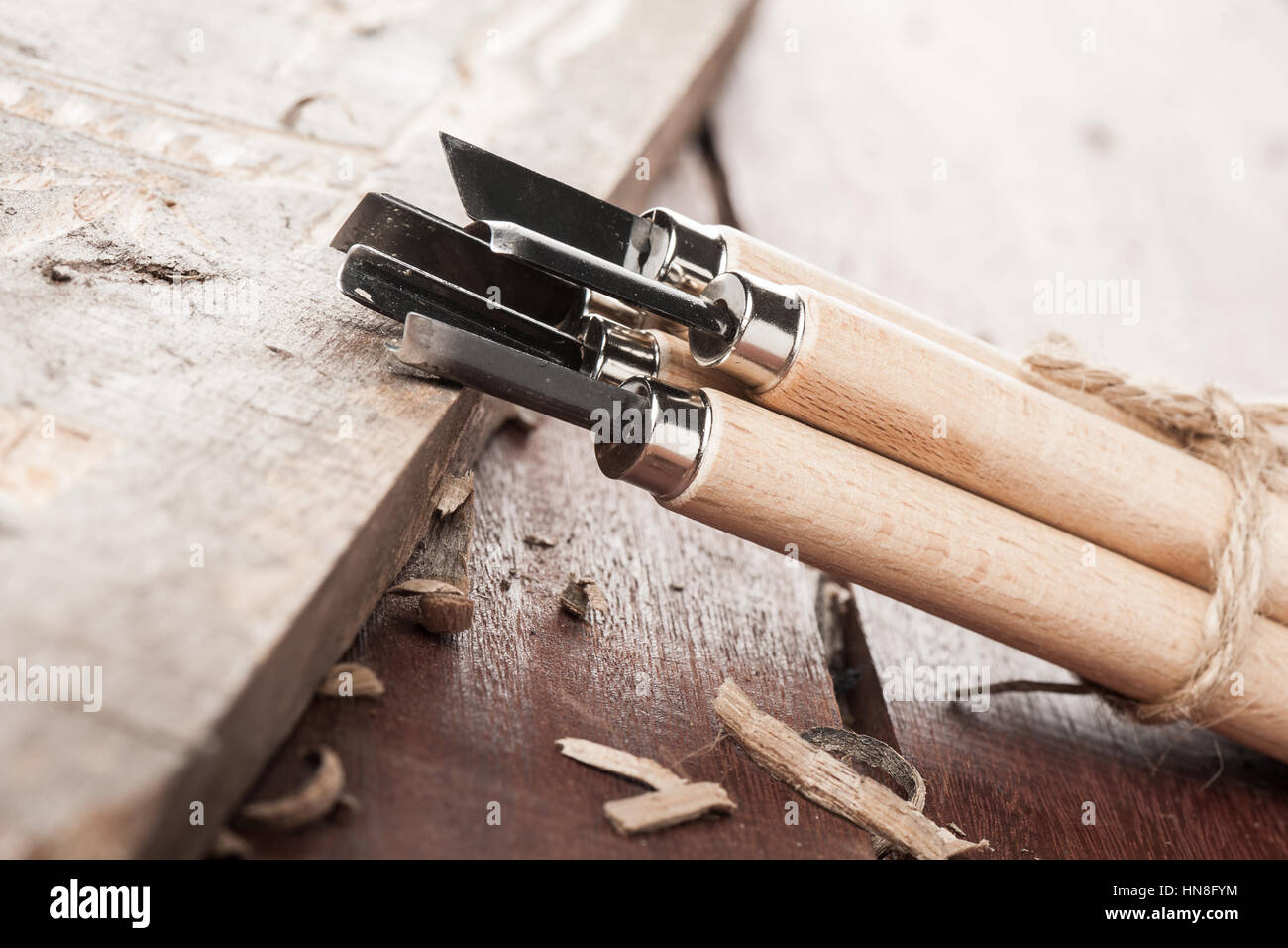 closeup chisels for wood on carpenter desktop Stock Photo - Alamy