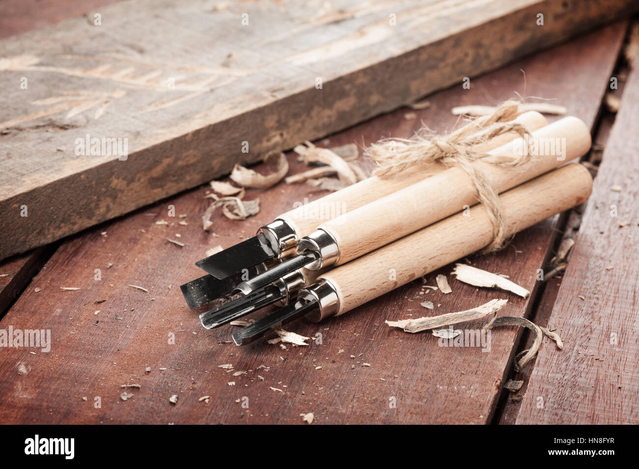 closeup chisels for wood on carpenter desktop Stock Photo - Alamy