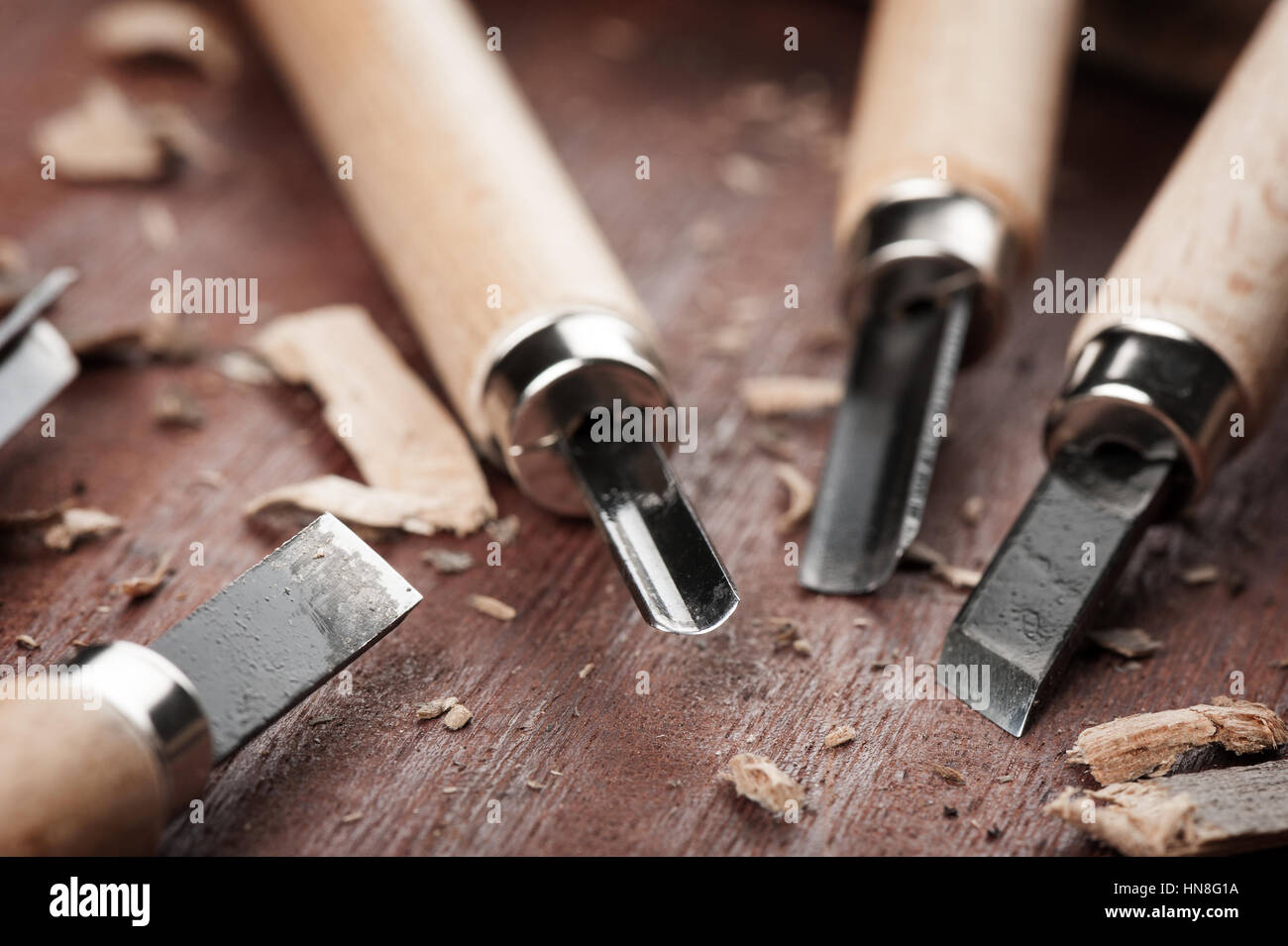 closeup chisels for wood on carpenter desktop Stock Photo - Alamy