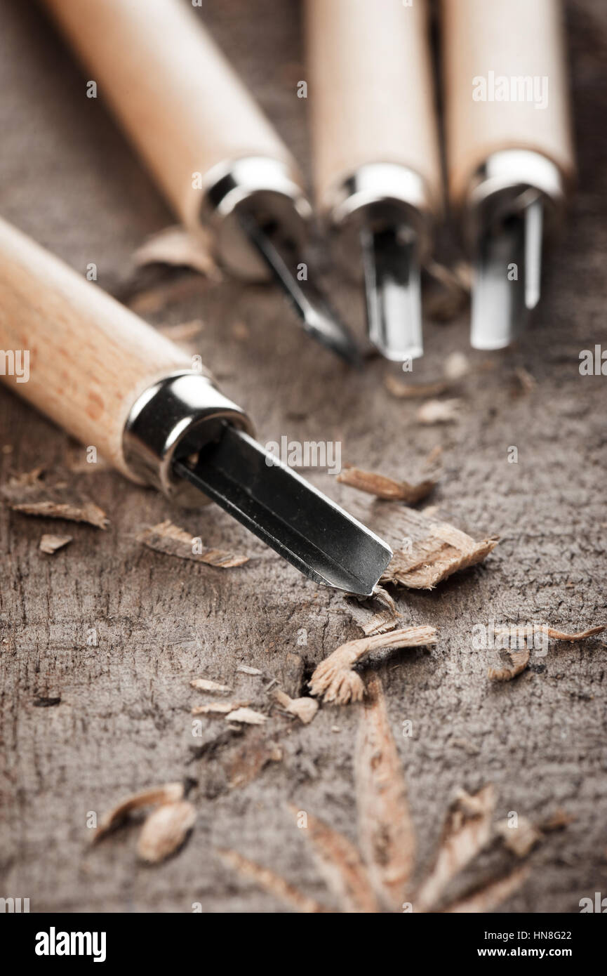 closeup chisels for wood on carpenter desktop Stock Photo - Alamy