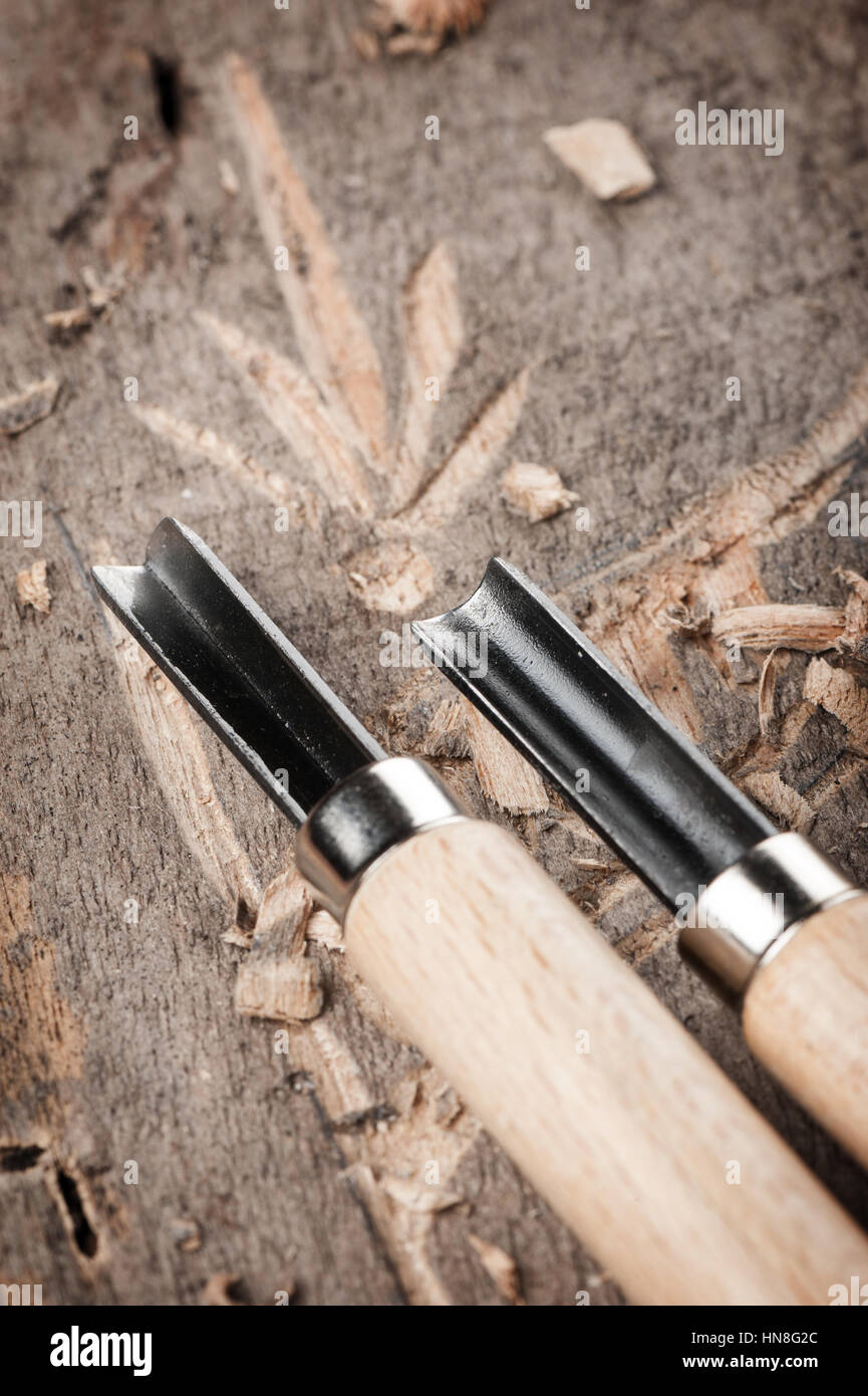 closeup chisels for wood on carpenter desktop Stock Photo - Alamy