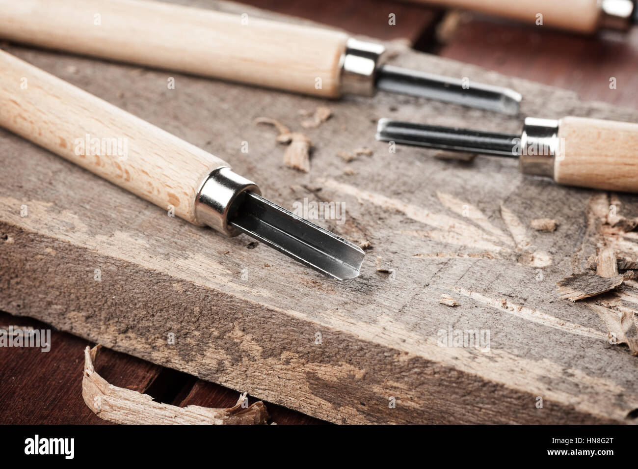 closeup chisels for wood on carpenter desktop Stock Photo - Alamy
