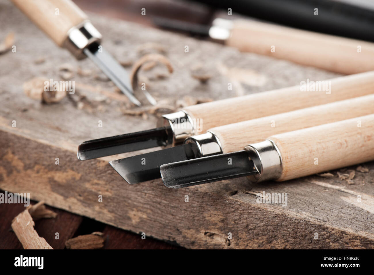 closeup chisels for wood on carpenter desktop Stock Photo - Alamy