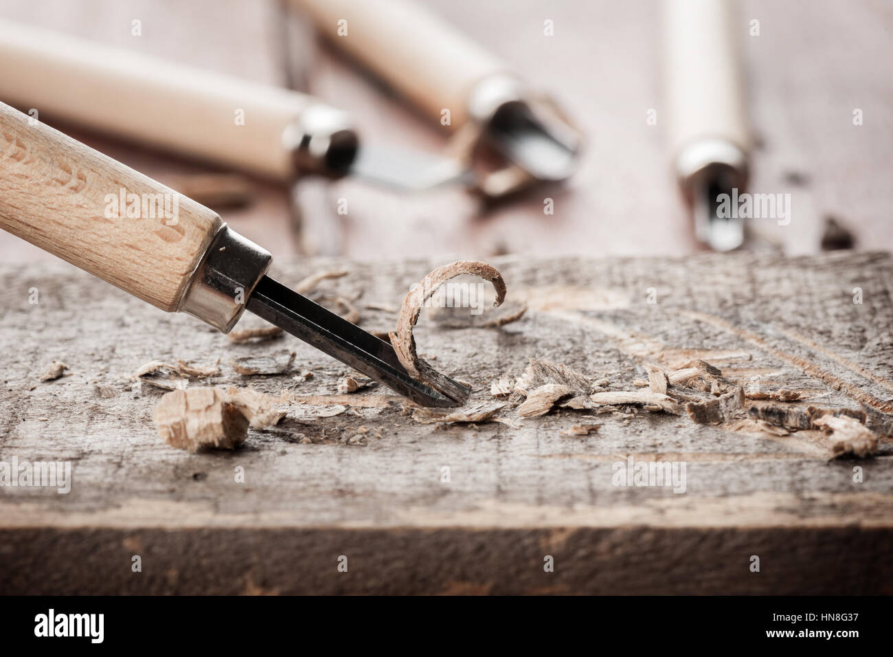 closeup chisels for wood on carpenter desktop Stock Photo - Alamy