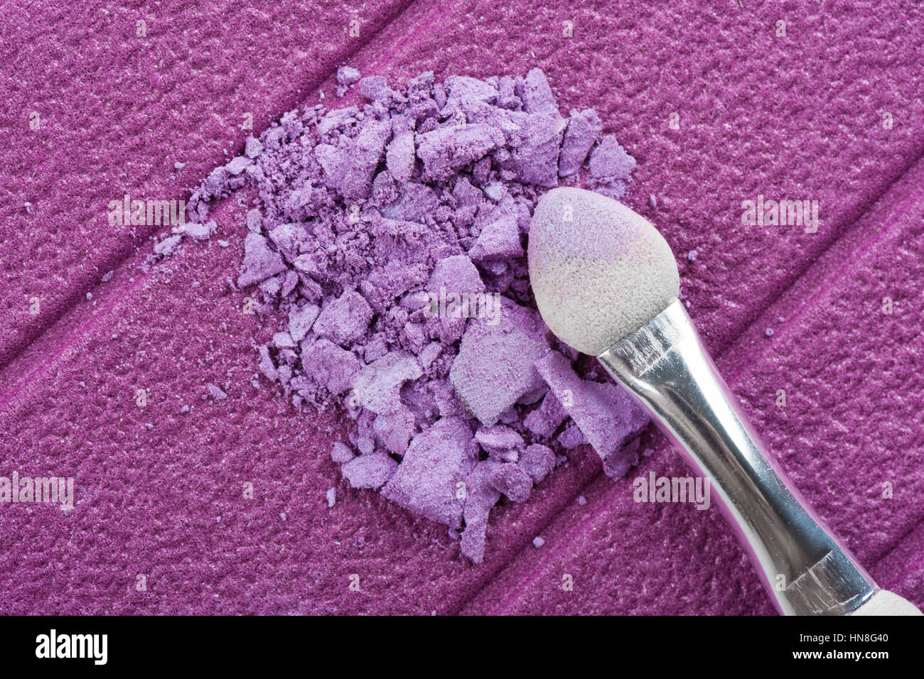 closeup purple cosmetics on purple background Stock Photo - Alamy
