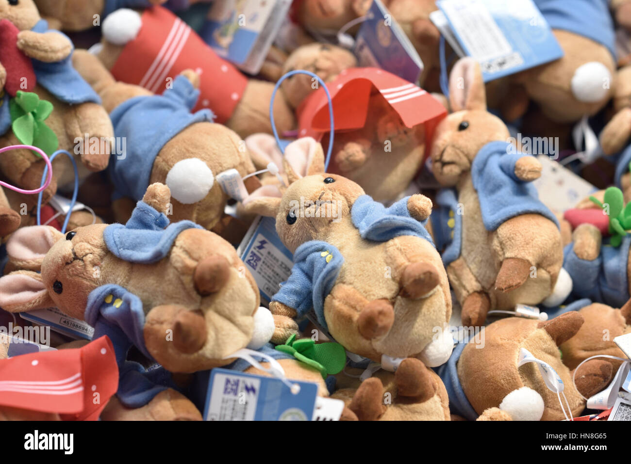 closeup cute rabbit dolls in claws crane machine Stock Photo - Alamy