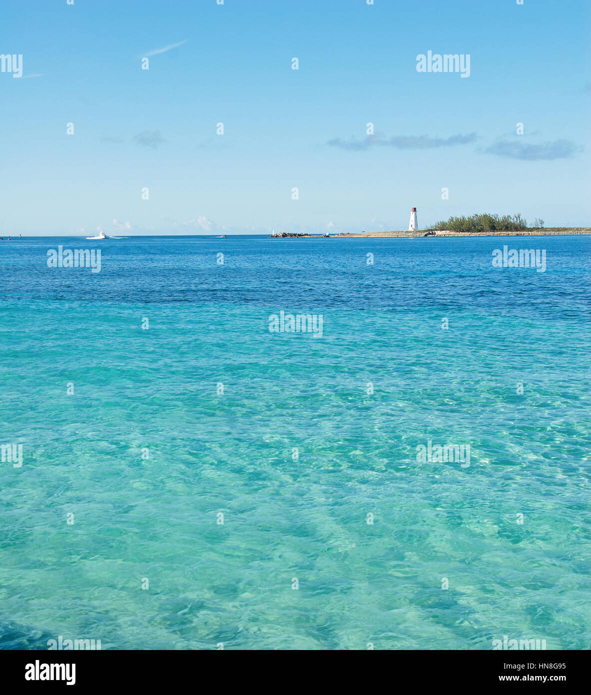 caribbean calm blue clean water with lighthouse on horizon Stock Photo ...