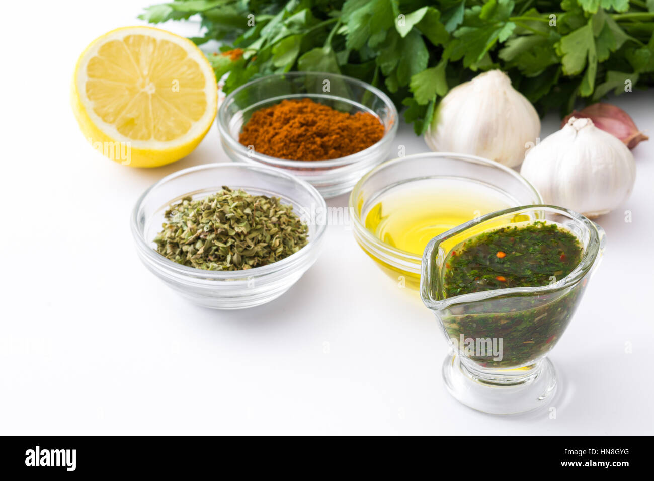 Green Chimichurri Sauce and ingredients isolated on white background ...