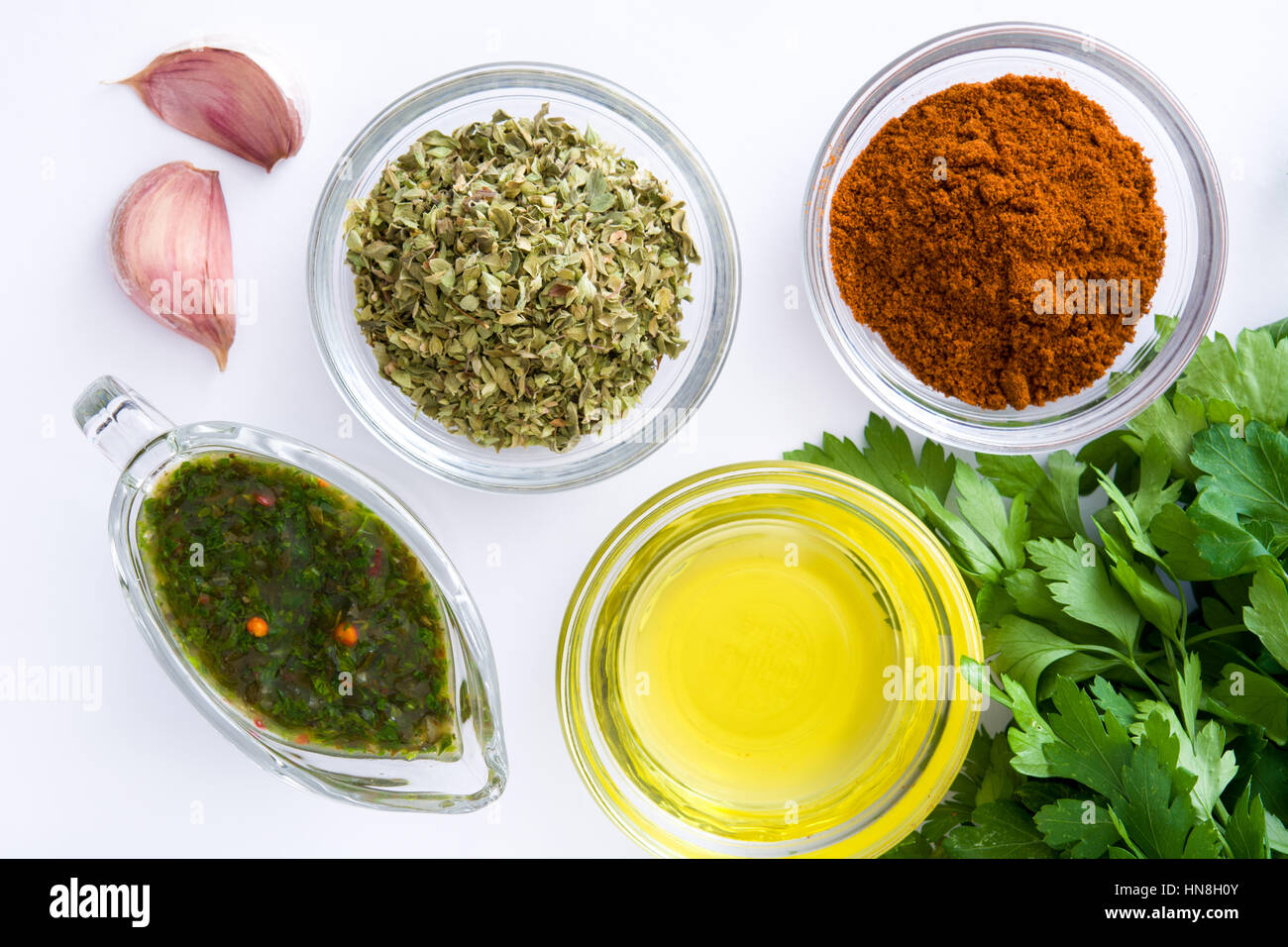 Green Chimichurri Sauce and ingredients isolated on white background ...