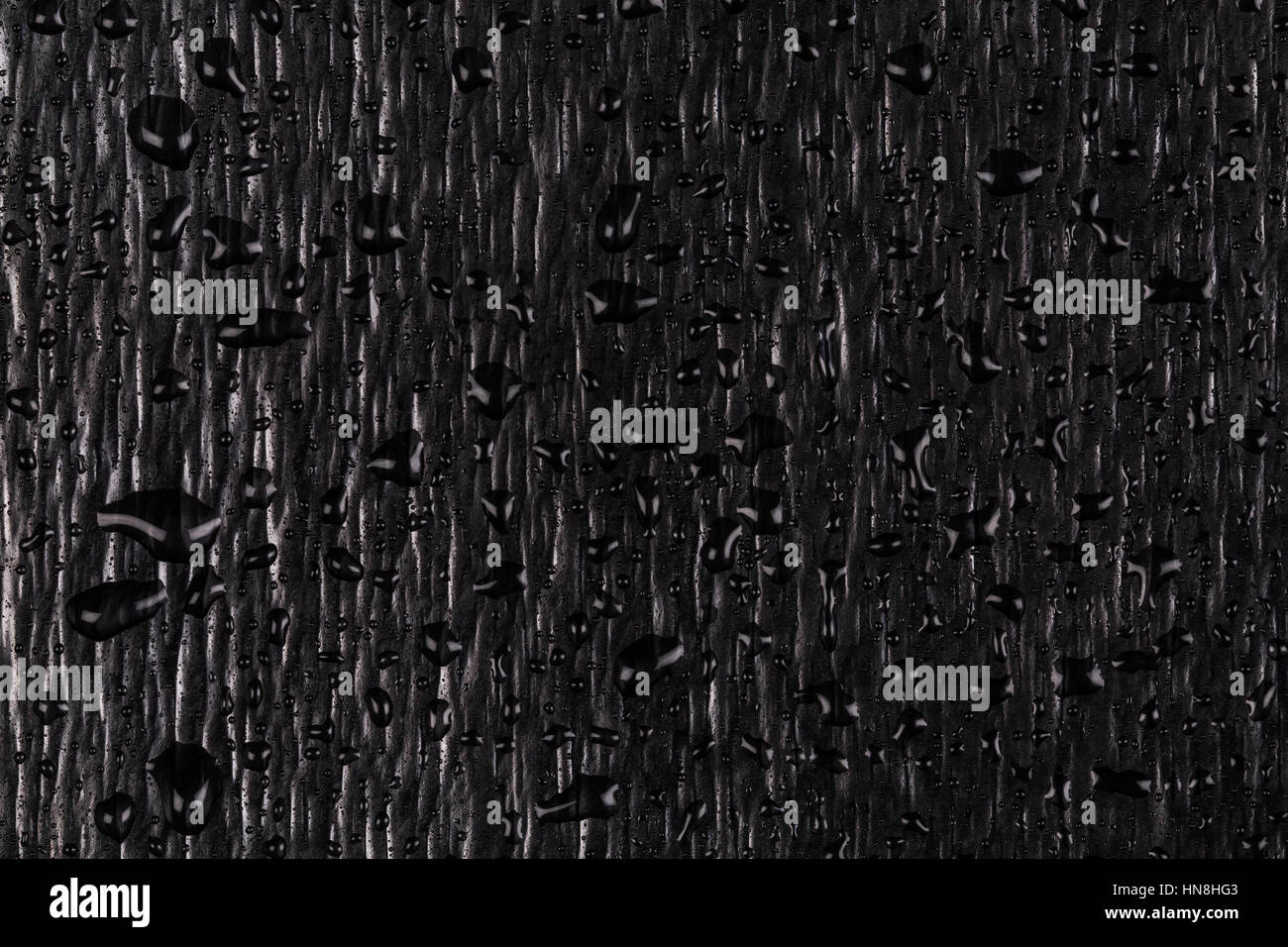 Water drops on dark stone surface texture background Stock Photo - Alamy