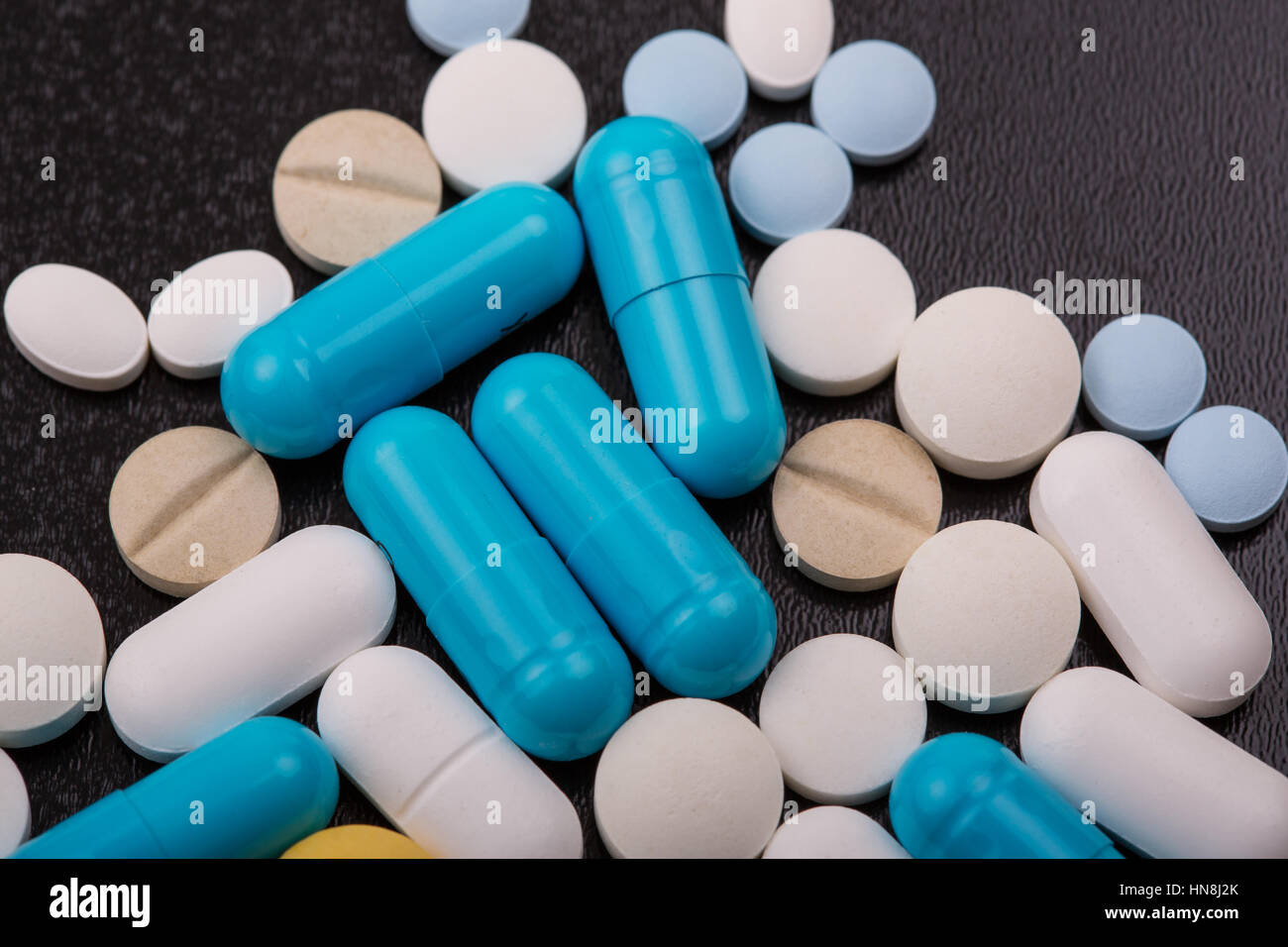different tablets pills capsule heap mix therapy drugs Stock Photo - Alamy