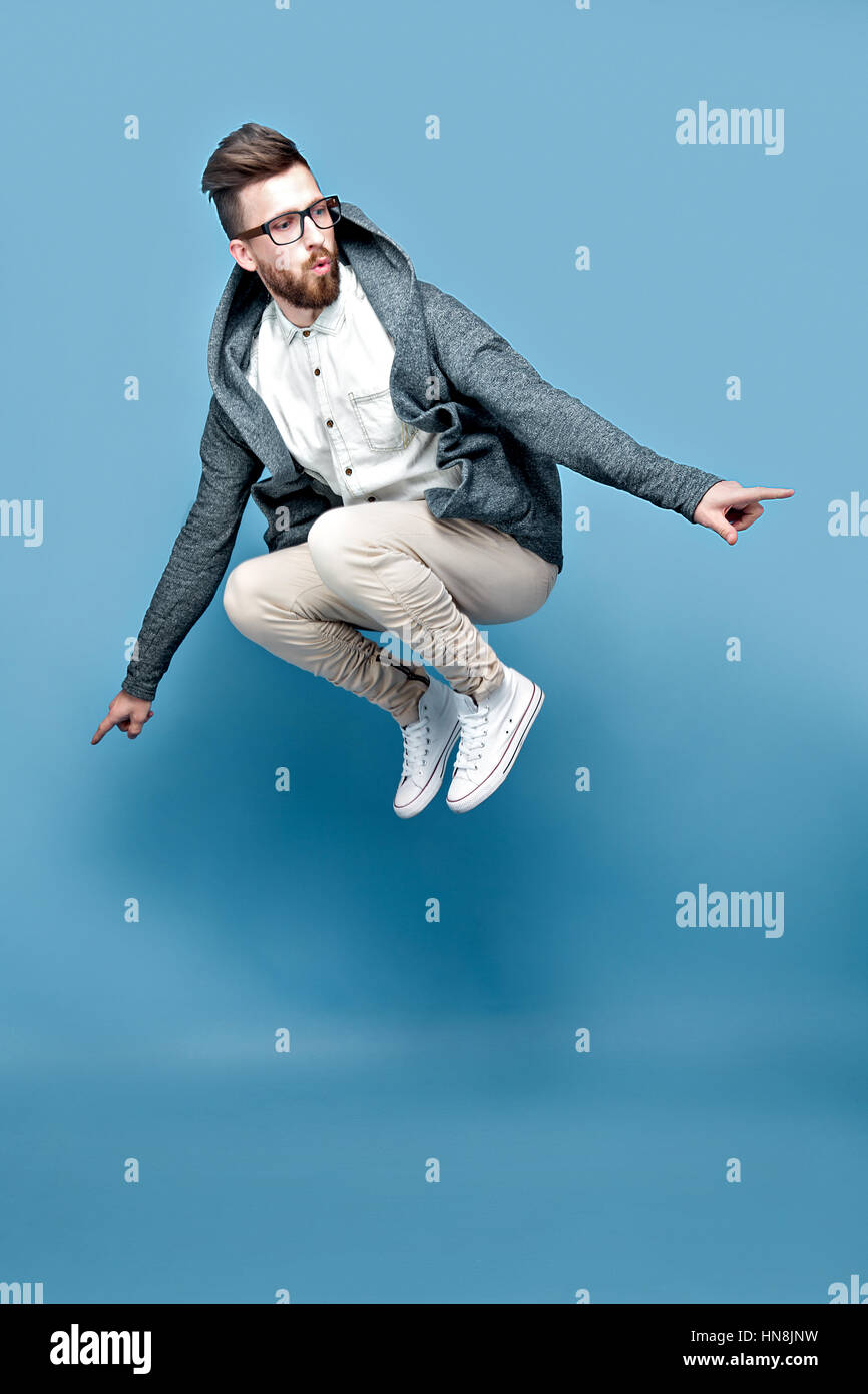 Young man jumping Stock Photo - Alamy