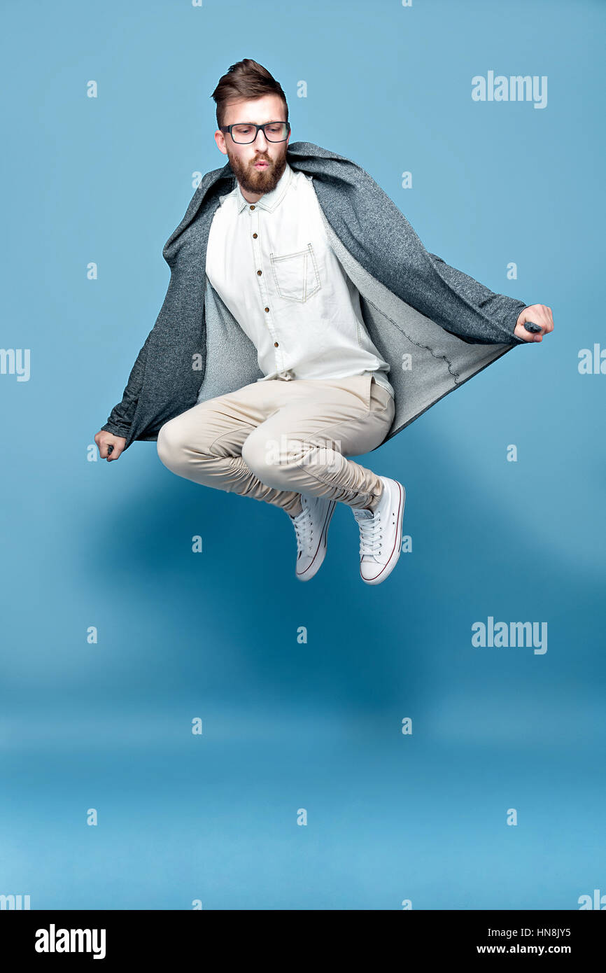 Young man jumping Stock Photo - Alamy