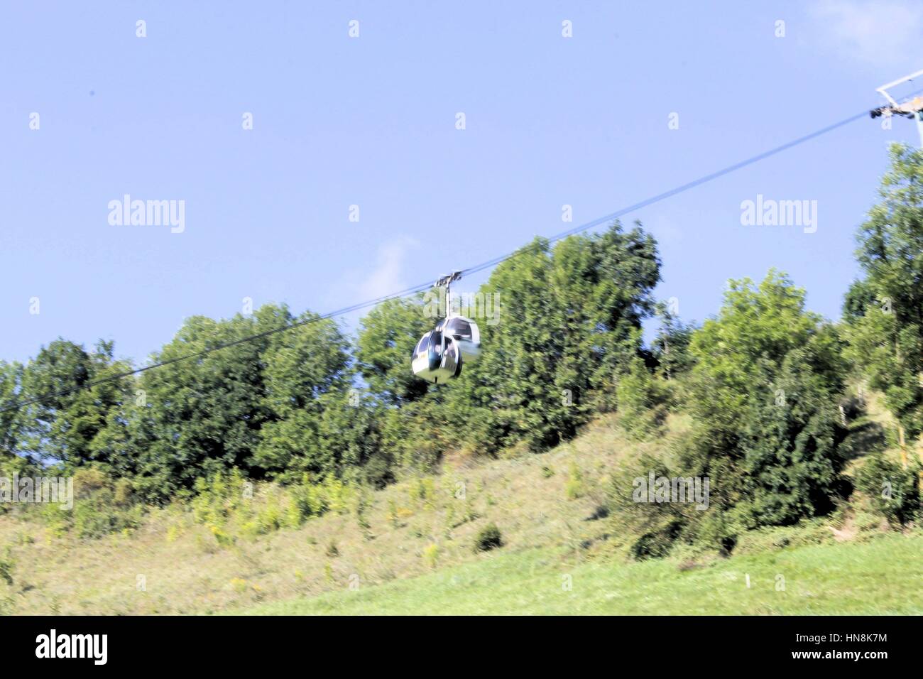 Chairlift ski lift in european Alps. Transporting hikers in summer ...