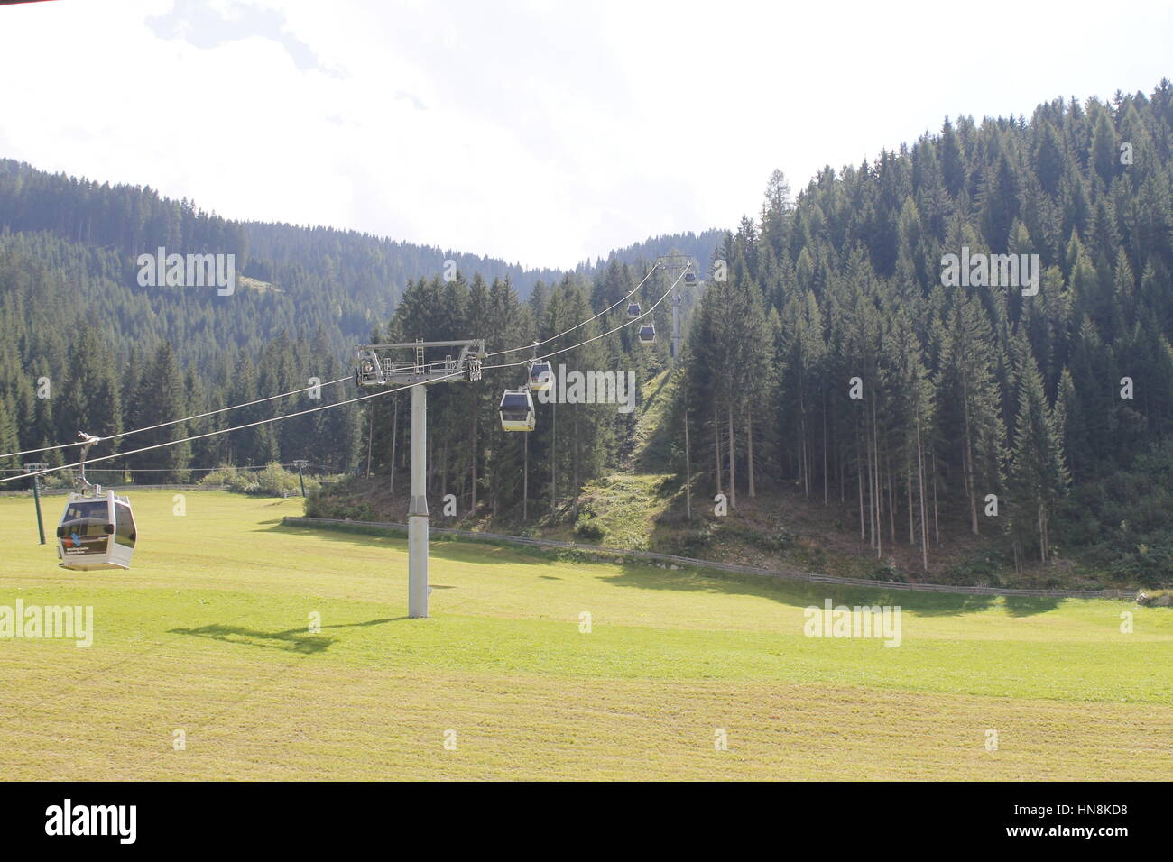 Chairlift ski lift in european Alps. Transporting hikers in summer ...
