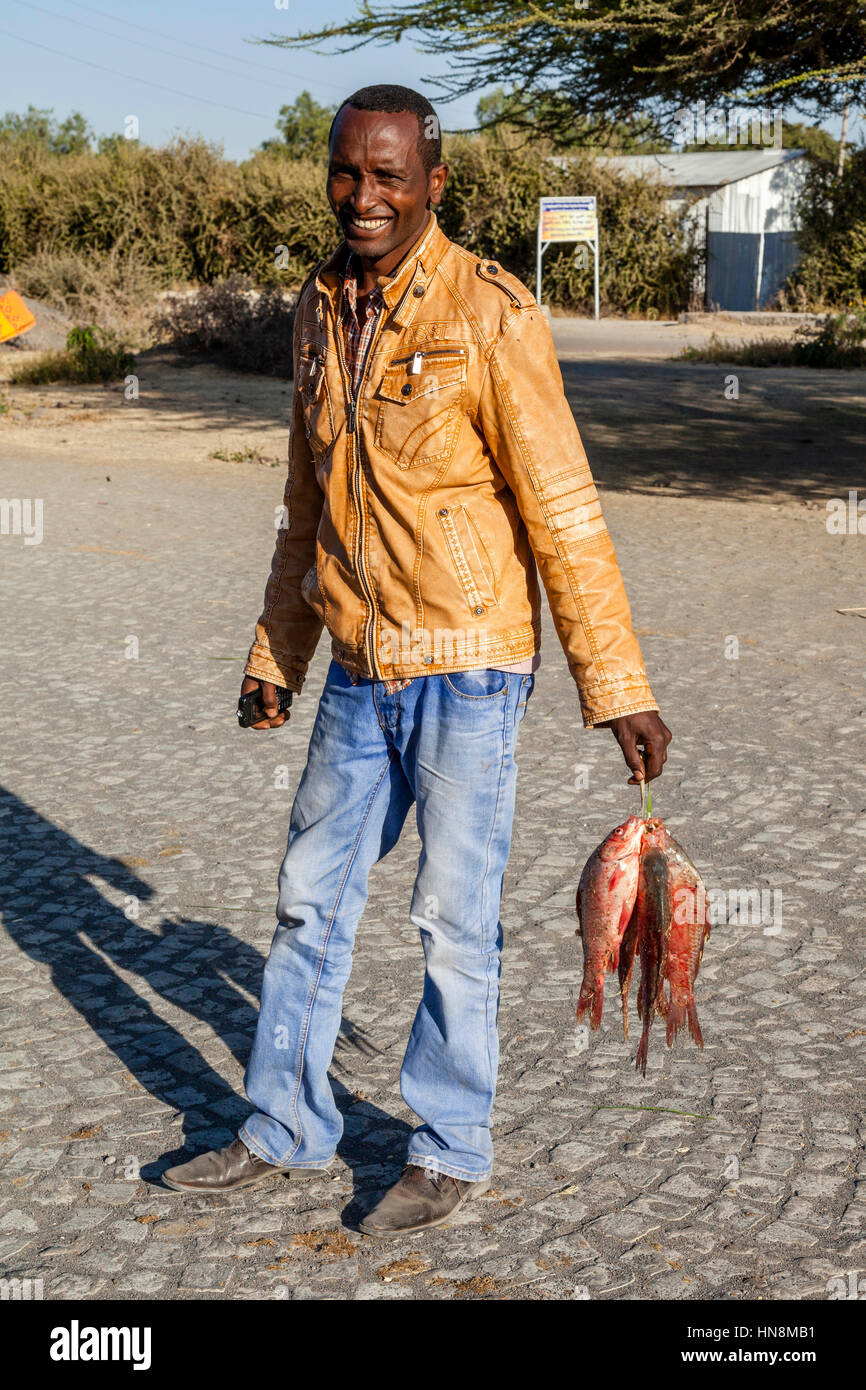 A Man Returns Home After Buying Fish At Lake Ziway, Ziway, Ethiopia ...