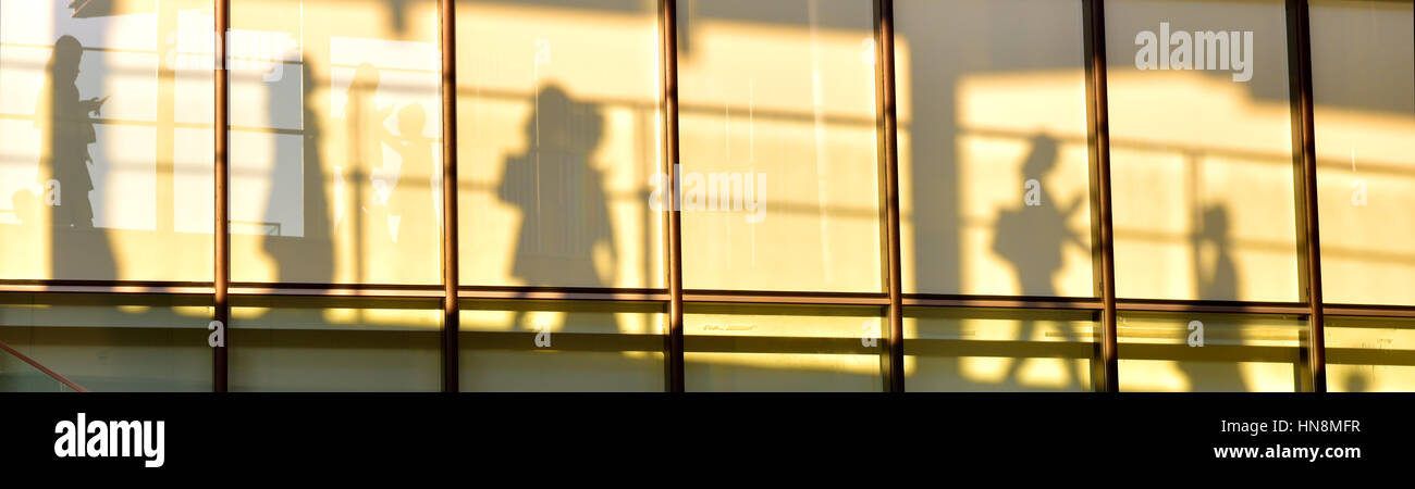 shadow of people walking on the building Stock Photo - Alamy